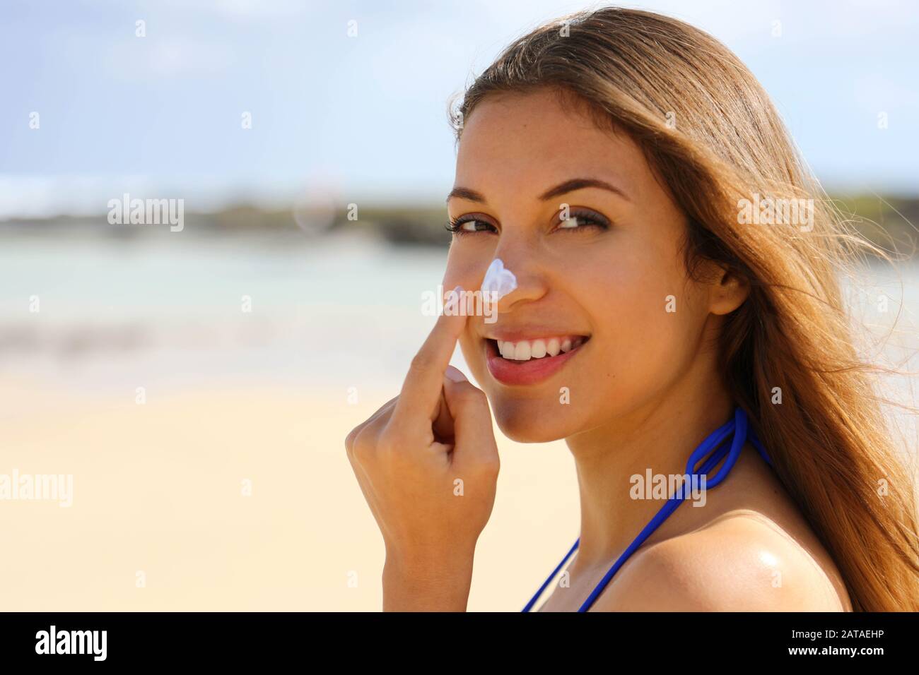 Close Up Young Beautiful Woman Applying Sun Cream Protection On Her