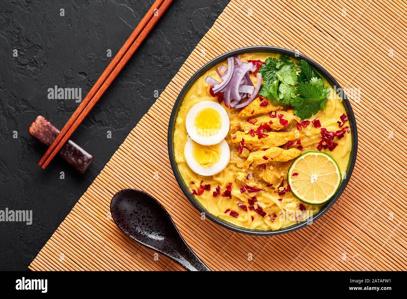 Ohn No Khao Swe in black bowl at dark slate background. Oh No Khao Suey ...