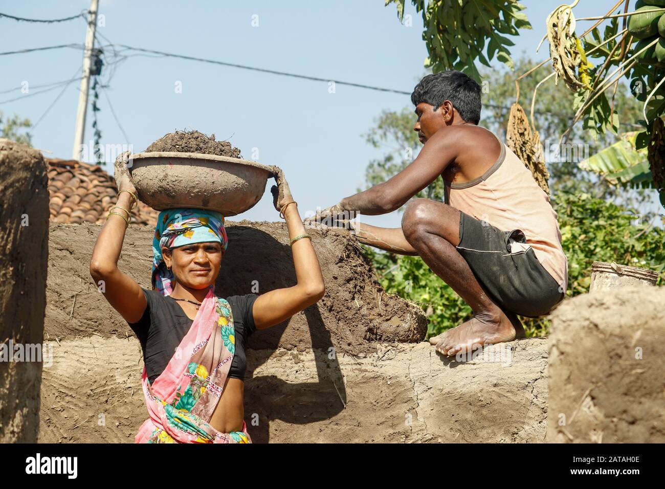 Mawai India Jan 28. 2020 : rural tribal man and woman are building mud ...