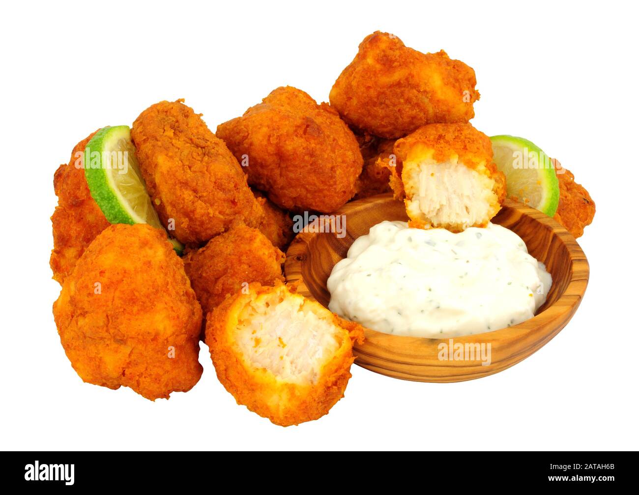 Chicken pakoras with raita dip in a wooden bowl isolated on a white ...