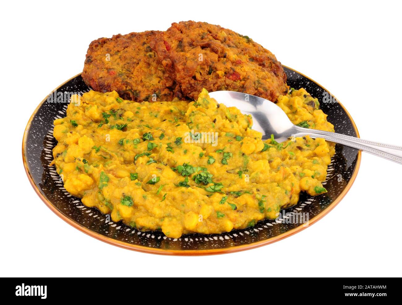 Indian tarka daal meal with onion bhaji isolated on a white background ...