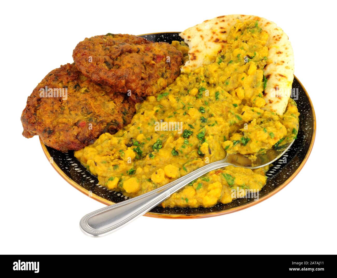 Indian tarka daal meal with onion bhaji isolated on a white background ...