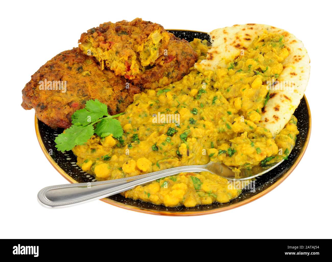 Indian tarka daal meal with onion bhaji isolated on a white background ...