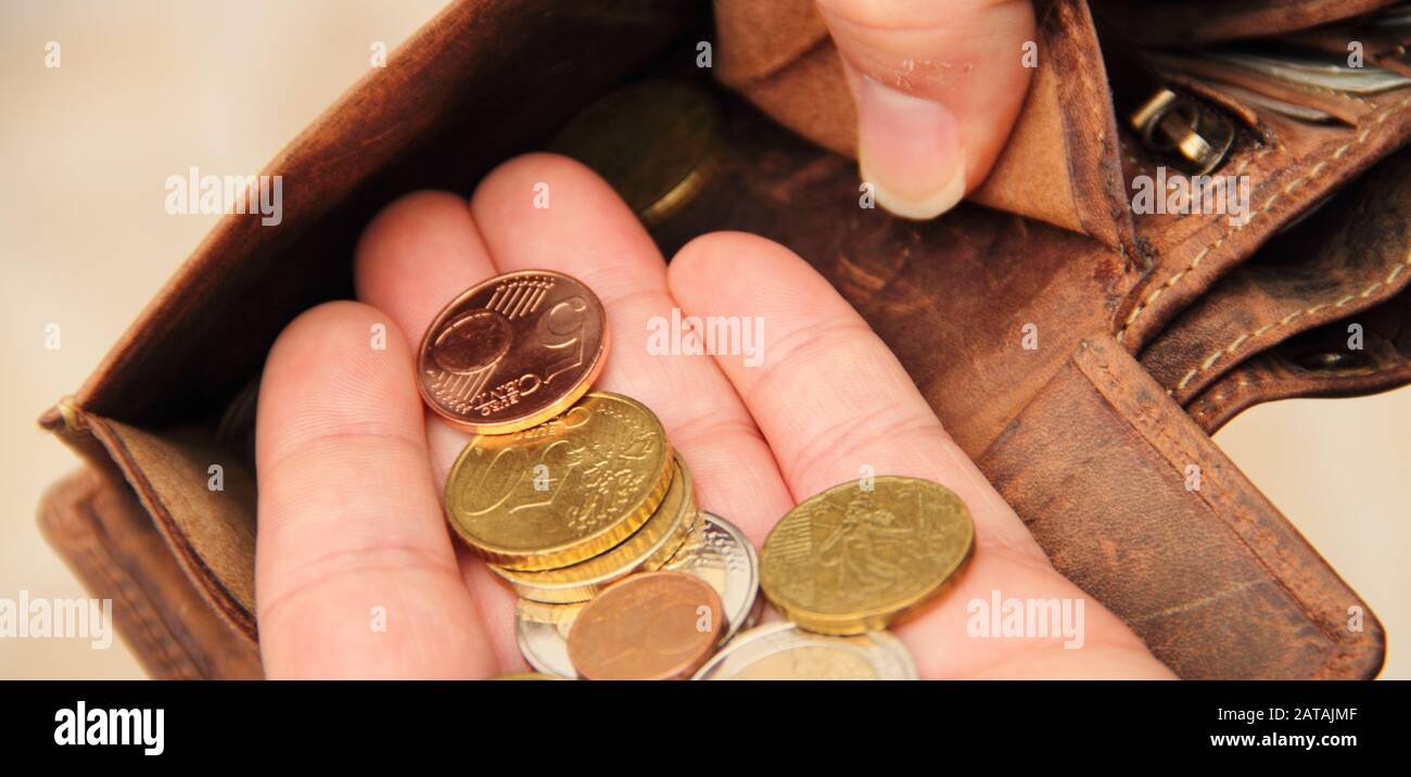 a handful of small money Stock Photo - Alamy