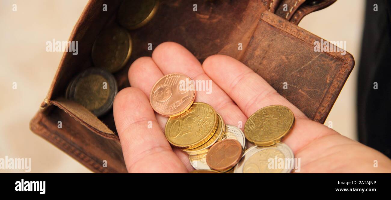 a handful of small money Stock Photo - Alamy