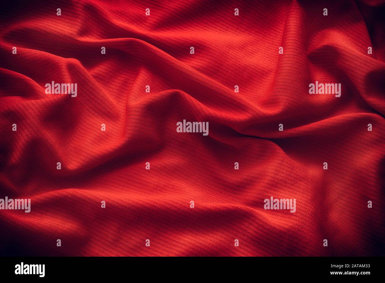 Dark red folded fabric texture background. Close up Stock Photo - Alamy