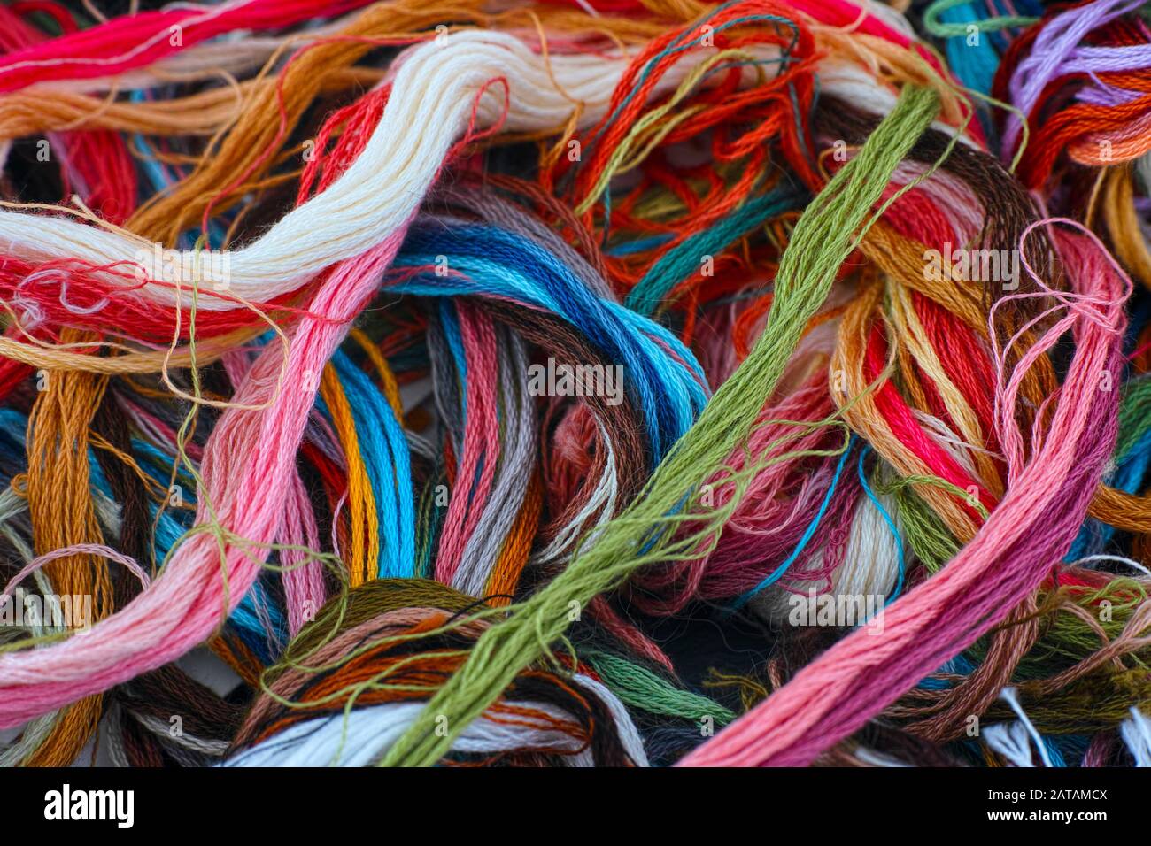Background of colored embroidery threads. Full frame Stock Photo - Alamy