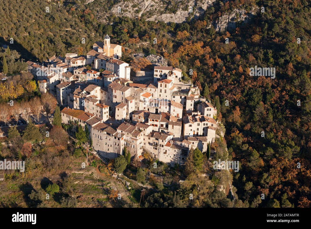 AERIAL VIEW. Cluster of homes of a medieval village built on a narrow ...