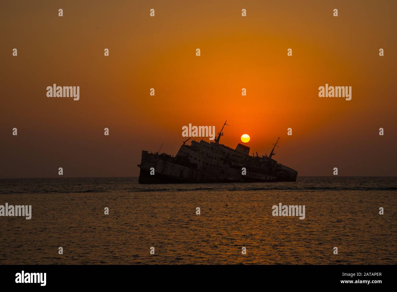 Al Qatan Beachand ship wreckage and Sun set Stock Photo - Alamy