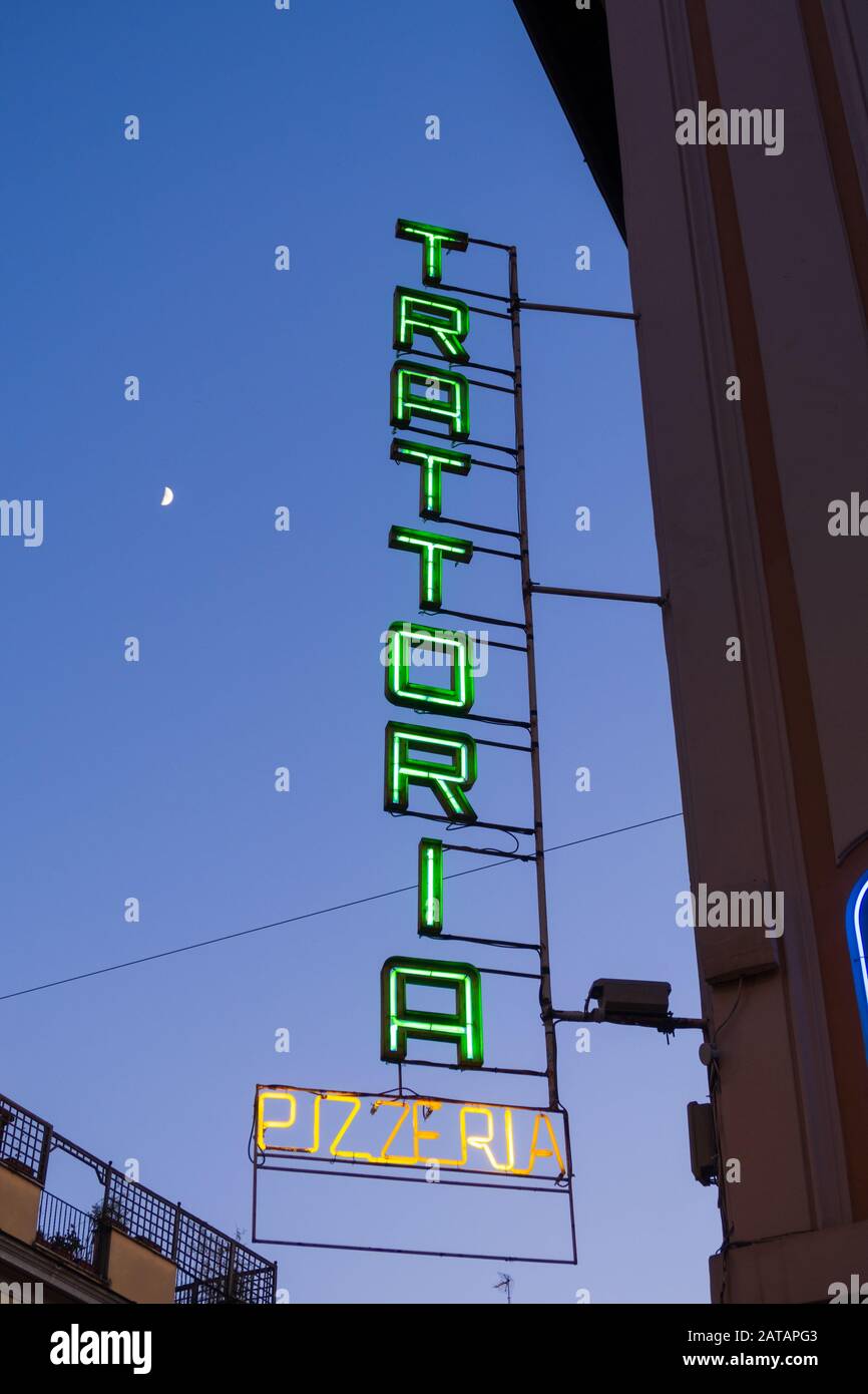Rome, Italy - Jan 2, 2020: A green neon Trattoria sign on the side of a ...
