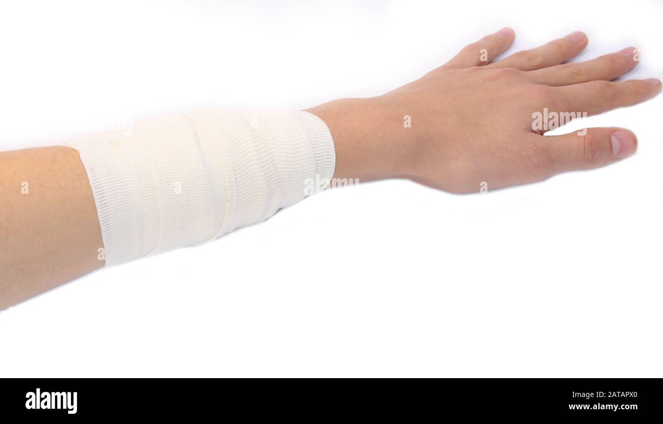 arm bandage of a boy after severe forearm burn on white background ...