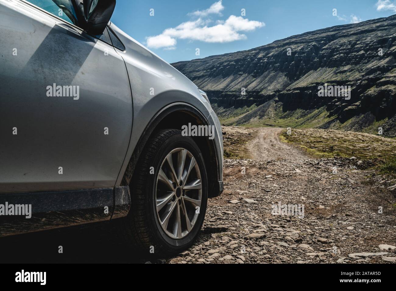 4WD SUV vehicle car running on gravel road with nature mountain ...