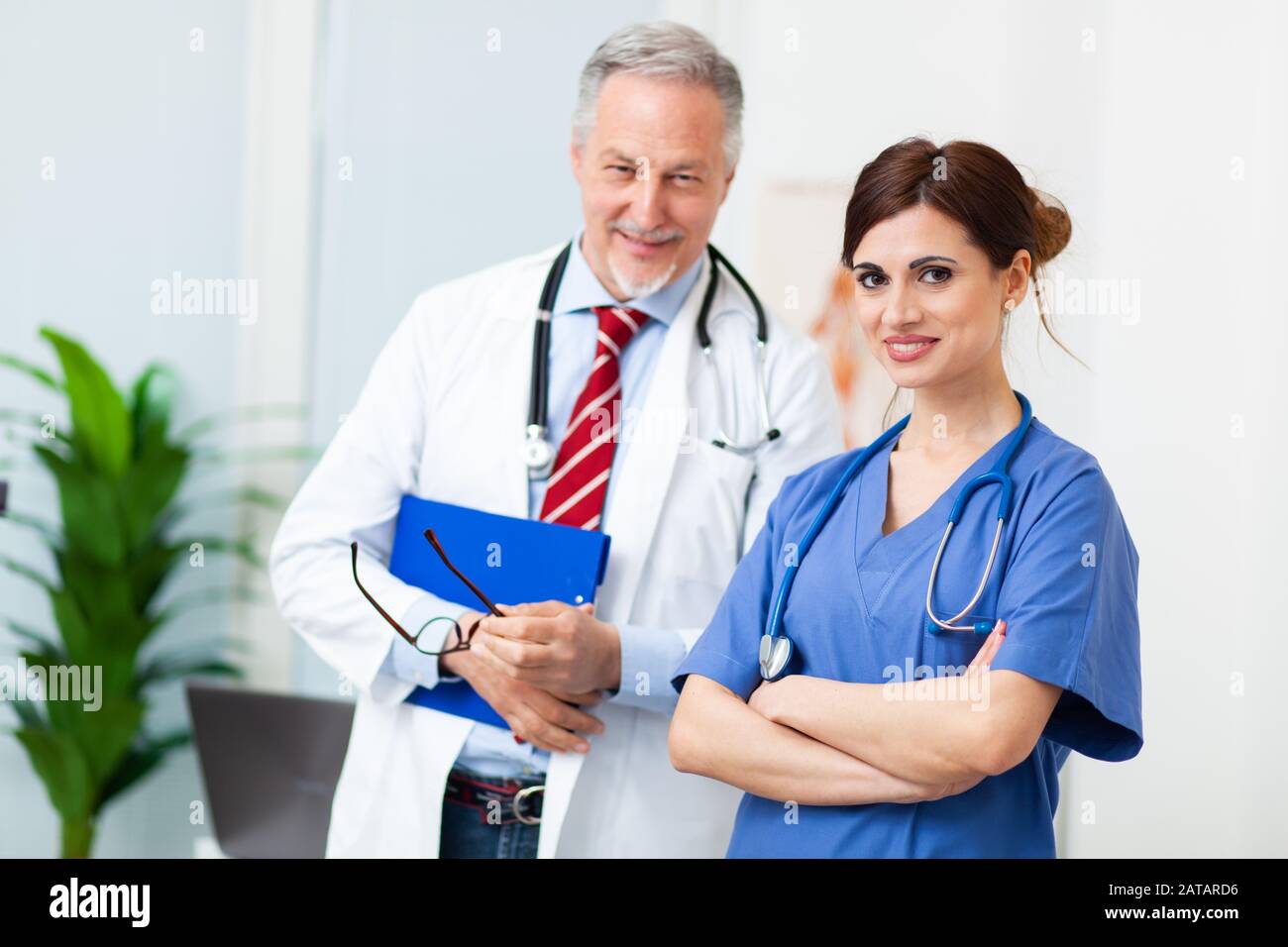 Medical colleagues smiling in their studio Stock Photo - Alamy