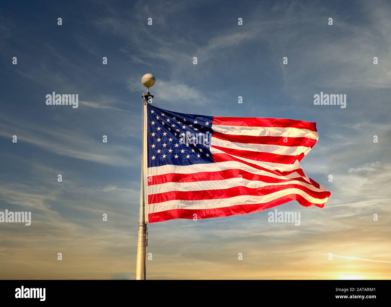 American Flag Blowing Sunset Sky Stock Photo - Alamy