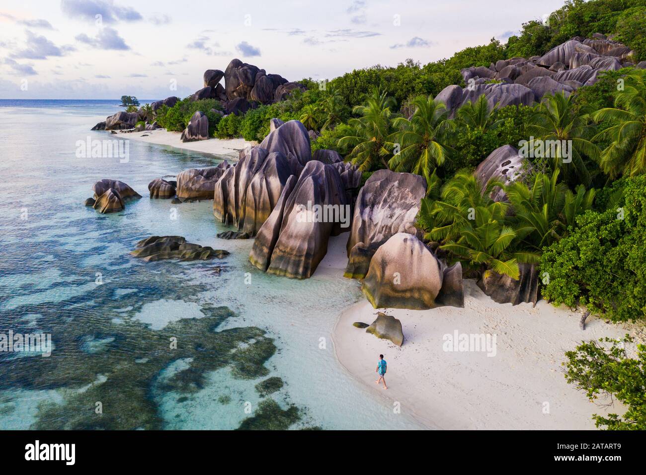 Tourist on a beautiful beach with white sand on a tropical island in ...