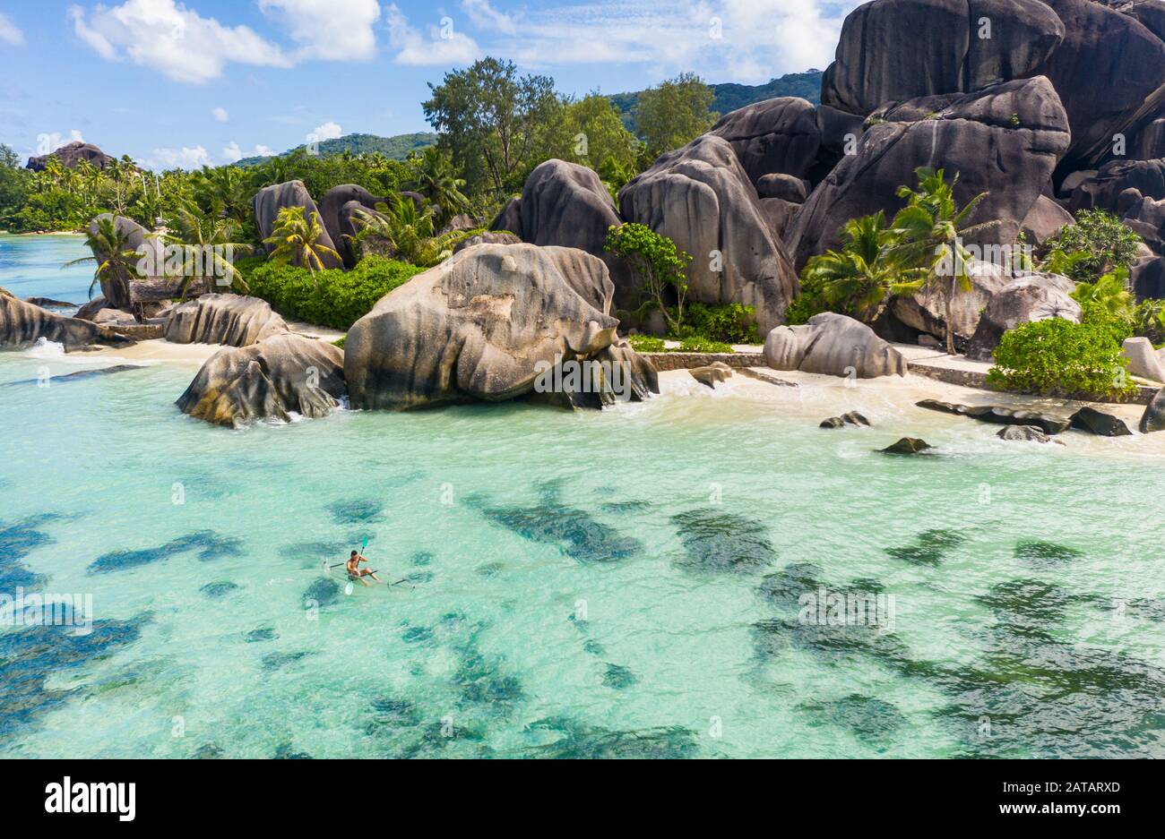 Beautiful beach with white sand on a tropical island in the Seychelles ...