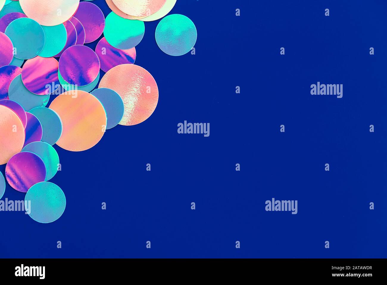 Border frame with big holographic sequins on classic blue background ...