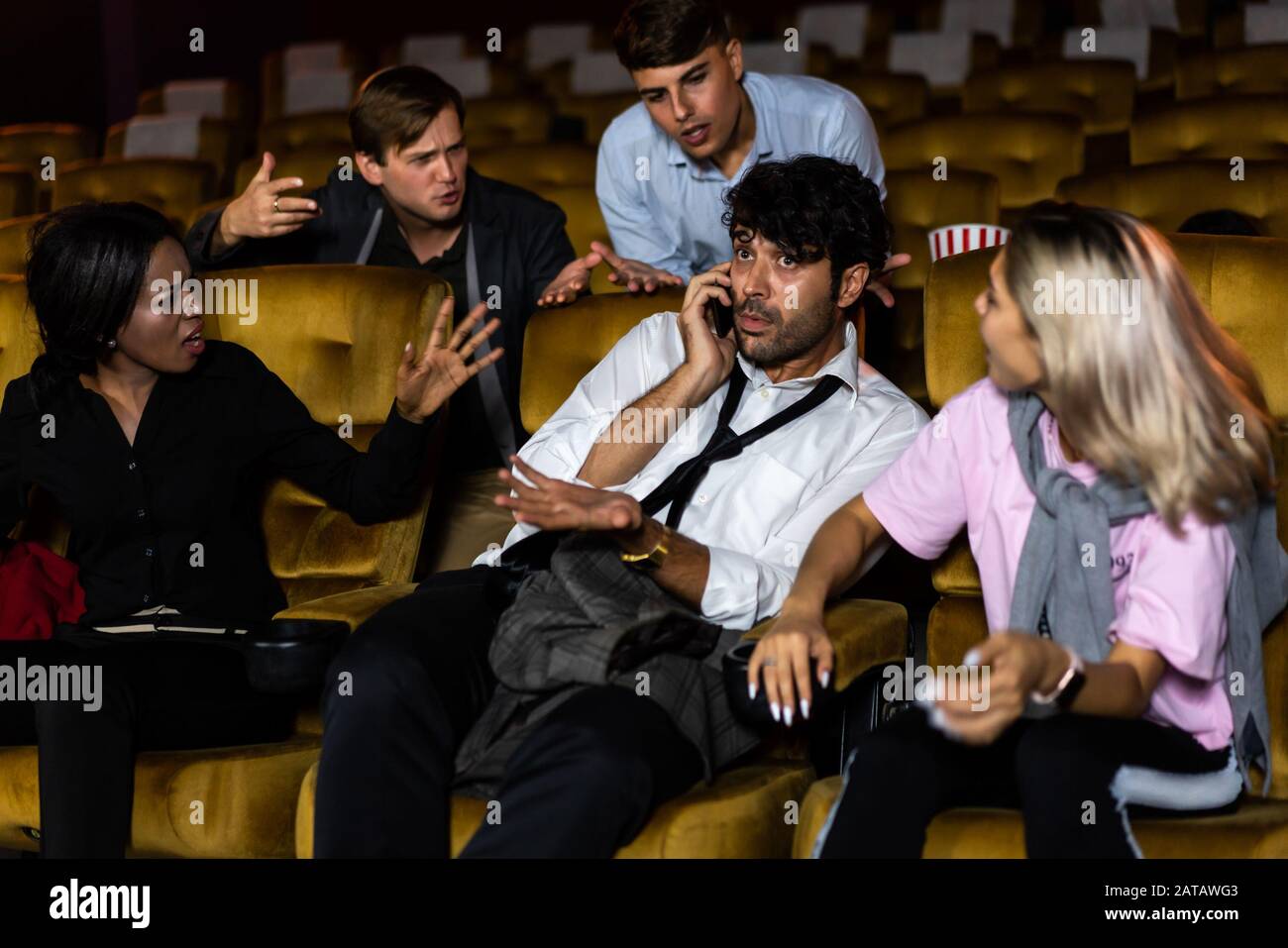 On Phone At Movie Theater