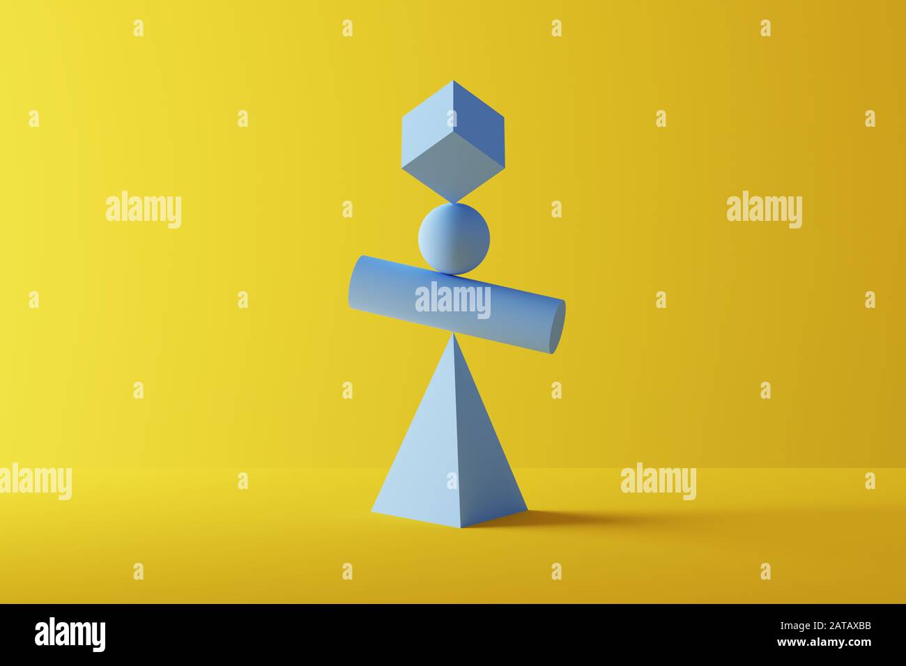 Primitive geometric shapes in perfect balance over yellow background ...