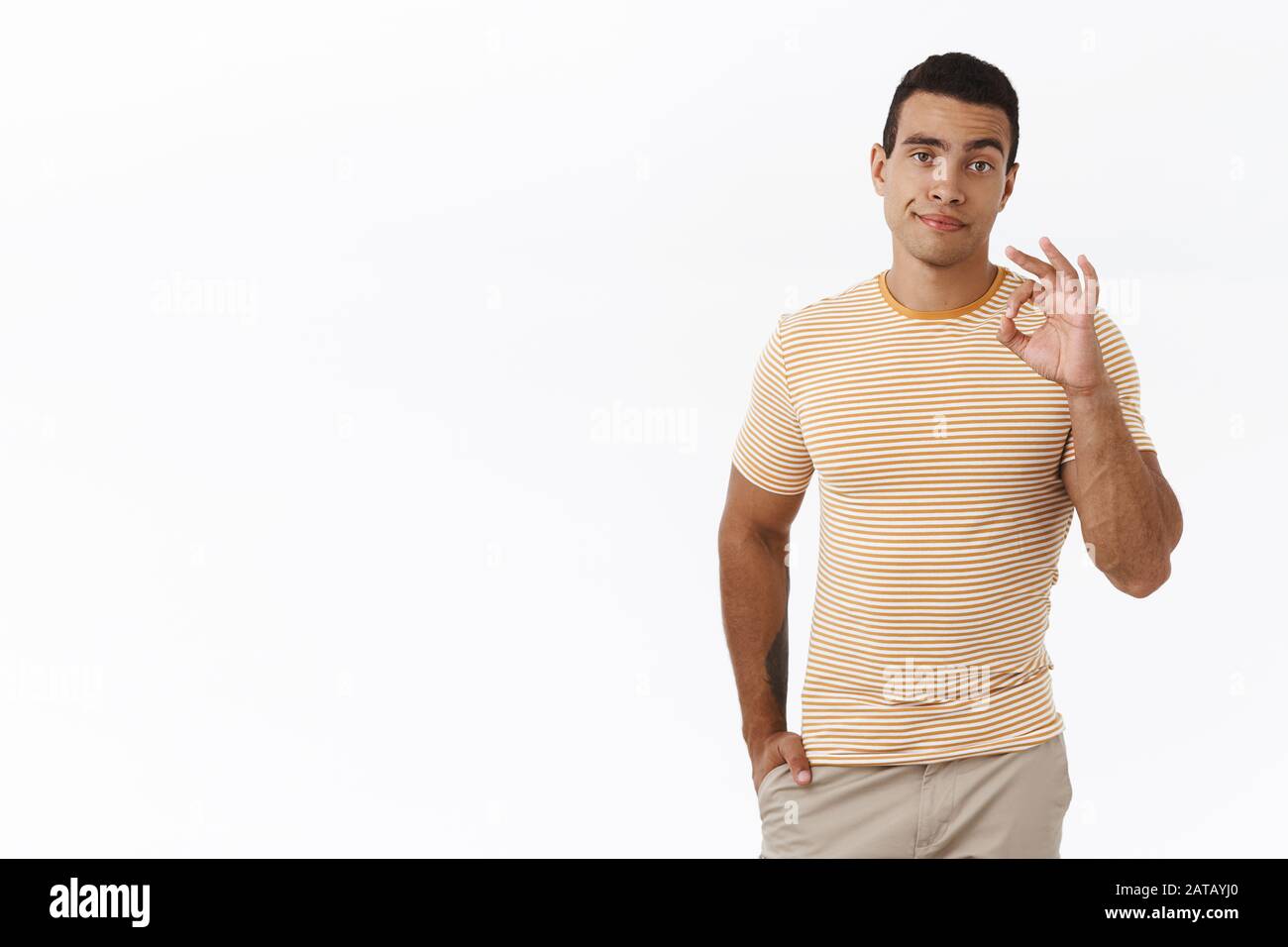 Skeptical Young Man Giving His Permission Showing Not Bad Gesture