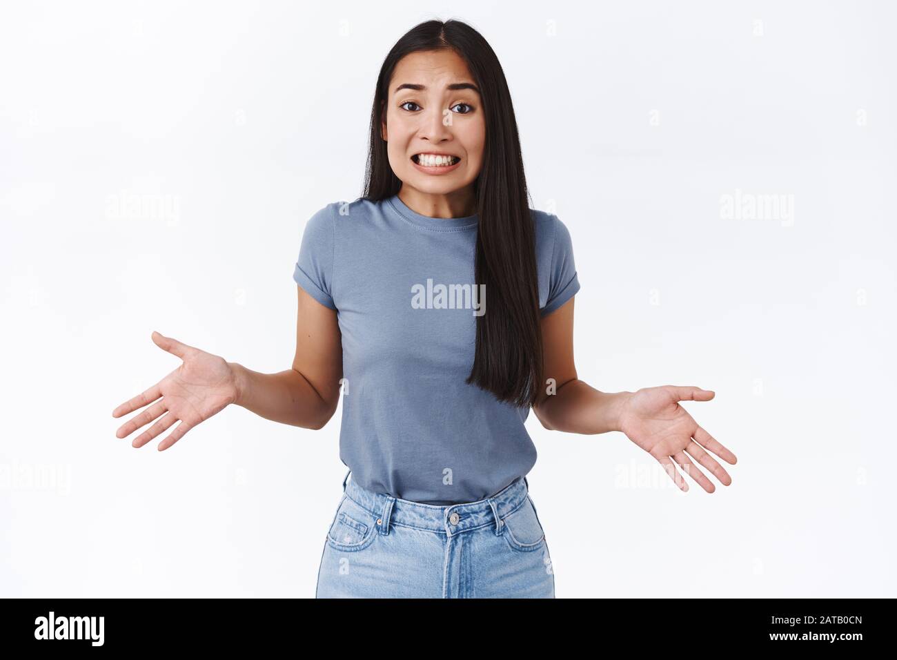 Awkward and embarrassed cute silly asian girl making mistake ...