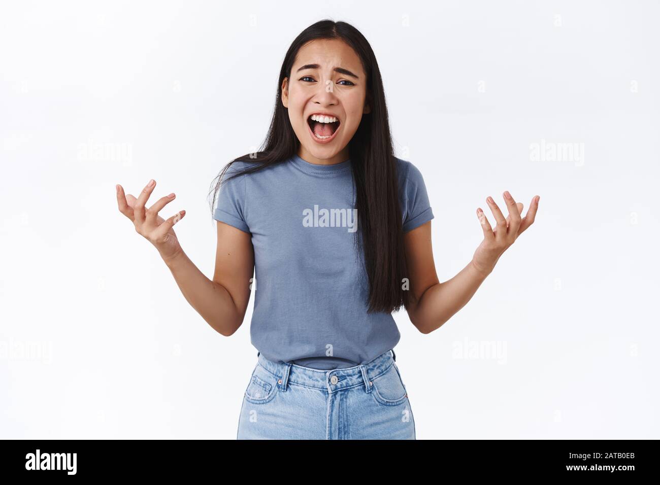 Fed up, distressed and angry young asian woman complaining, having huge ...