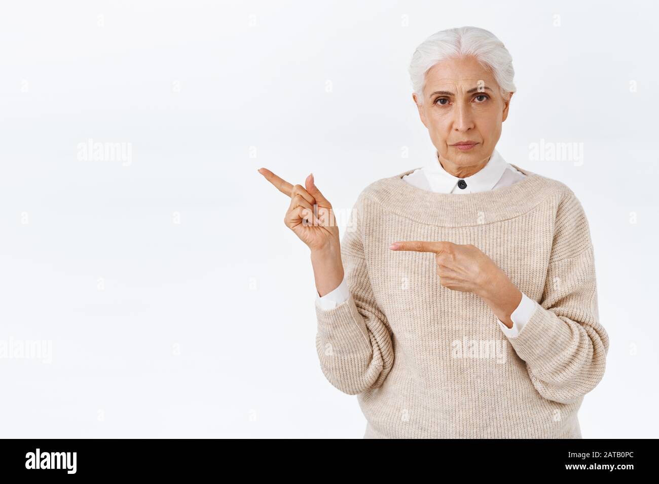 Serious frowning female entrepreneur hi-res stock photography and ...