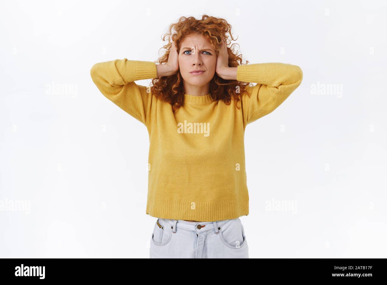 Annoyed and displeased girl didnt like how friend sing, close ears and ...