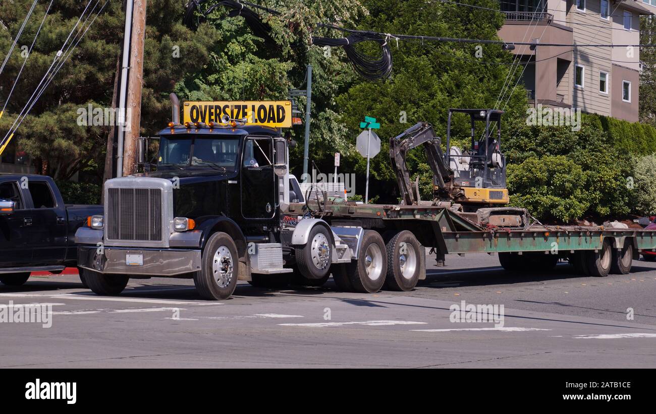 A truck with a special semi-trailer for transporting oversized loads ...