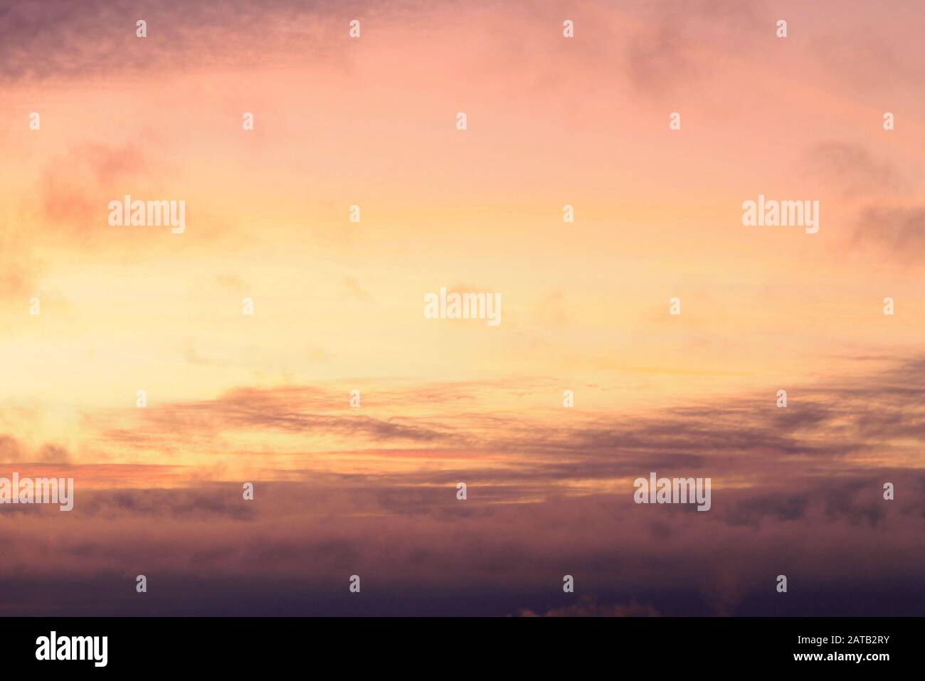 A beautifully backlit colorful sunset sky with the colors of sunrise ...