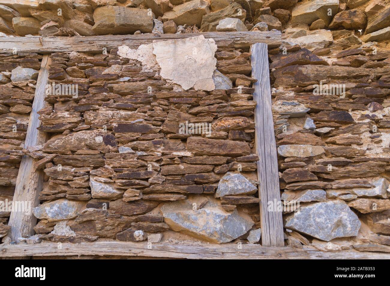 Stone Wall . Isolated. Abandoned ready to fall stone wall . Stock Image ...