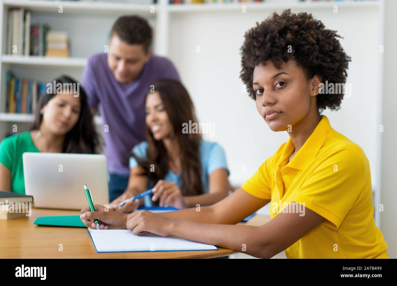Multiethnic students writing test hi-res stock photography and images ...