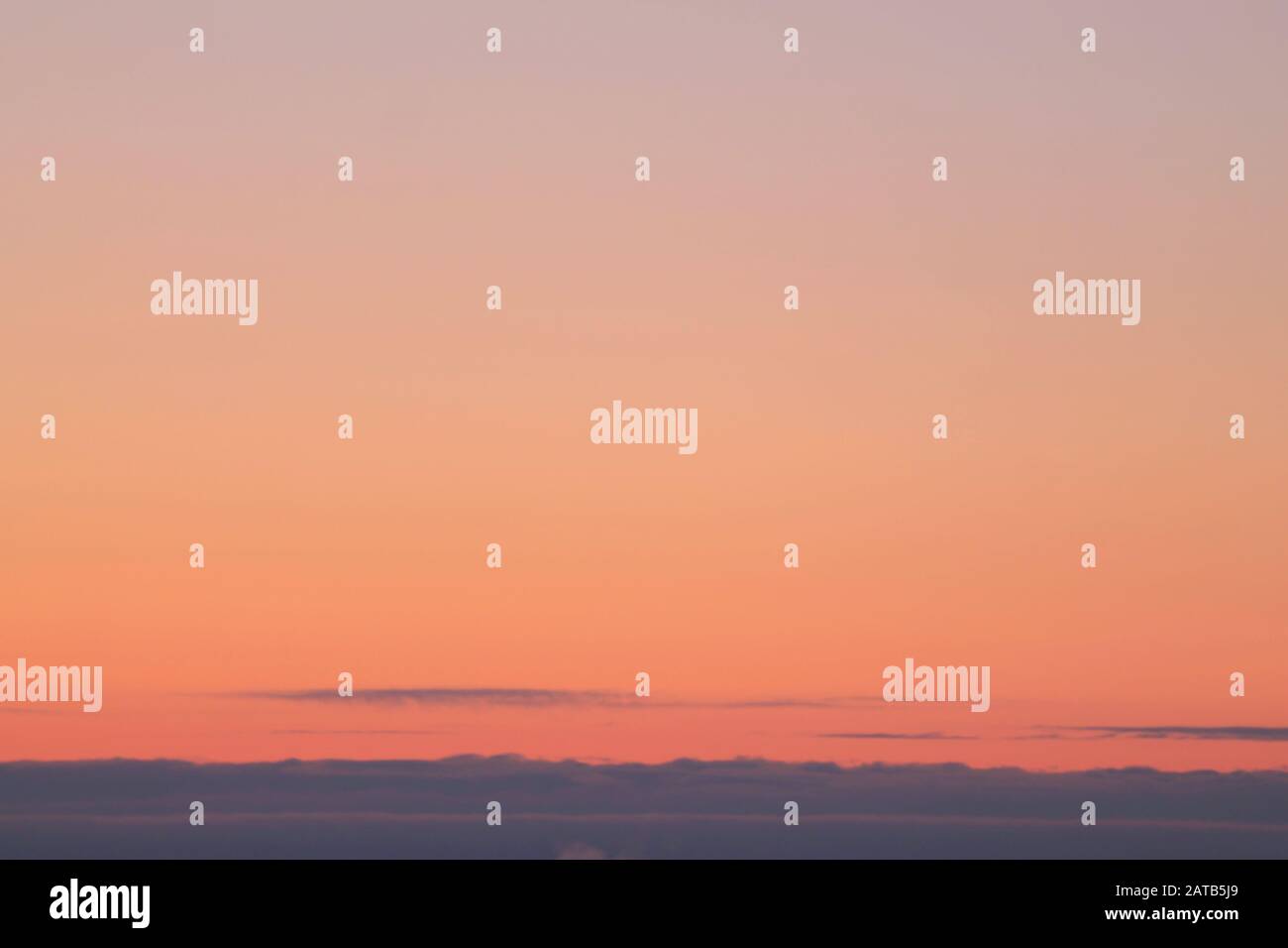 A beautifully backlit colorful sunset sky with the colors of sunrise ...