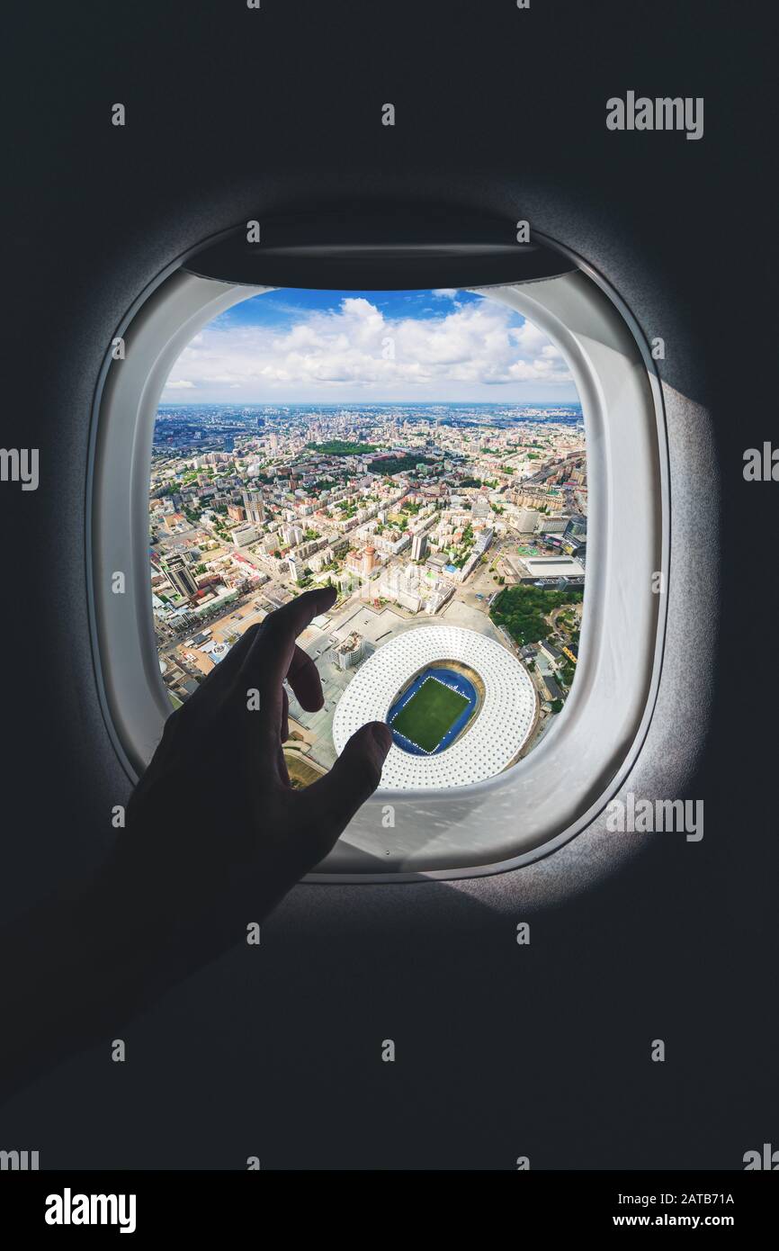 Airplane window with a aerial panorama of Kiev, Ukraine during a flight ...