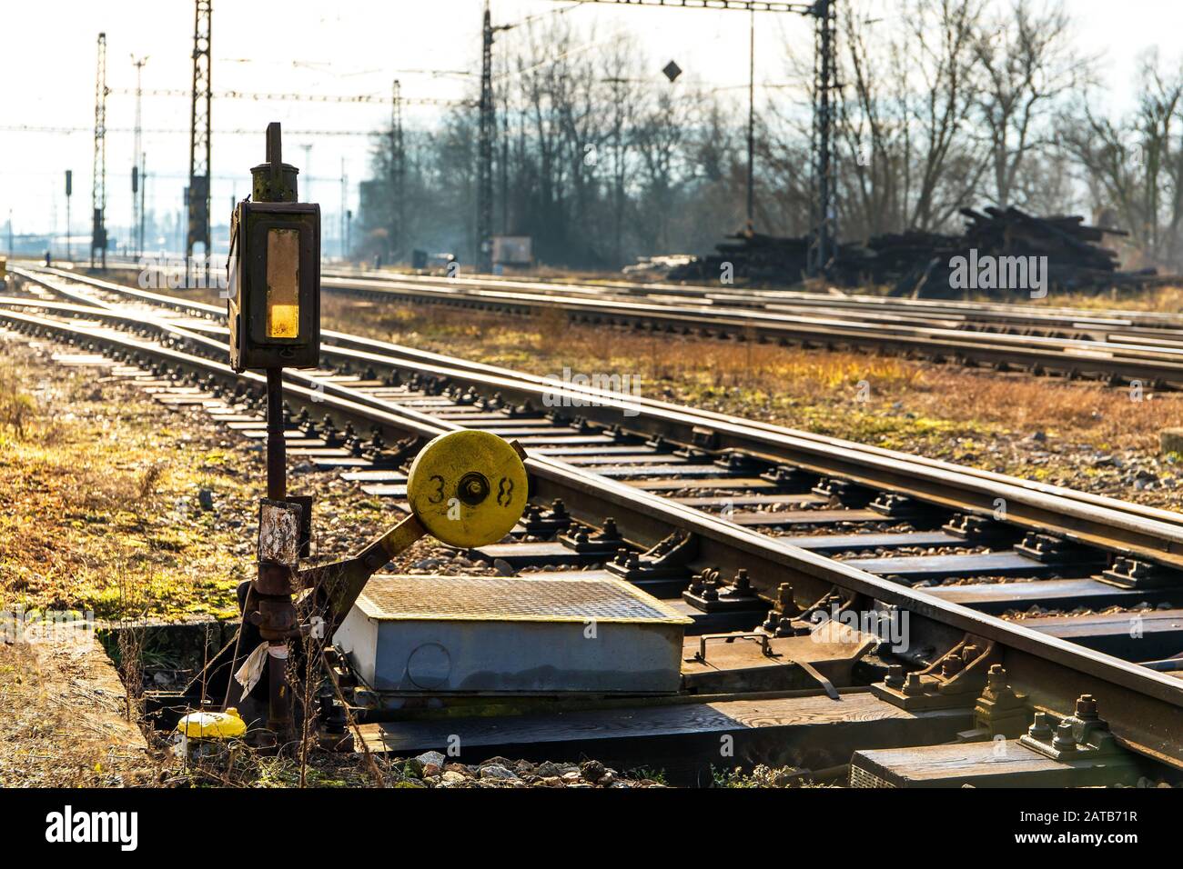Old railway turnout and rail crossing. Sunlit railroad tracks and ...