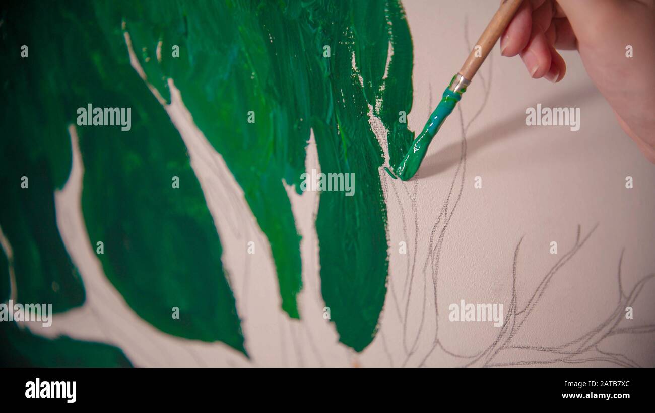 Womans hand drawing paintbrush on hi-res stock photography and images ...