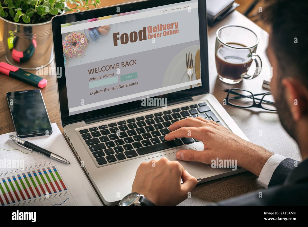 Food online order and delivery app on laptop computer screen, man at ...