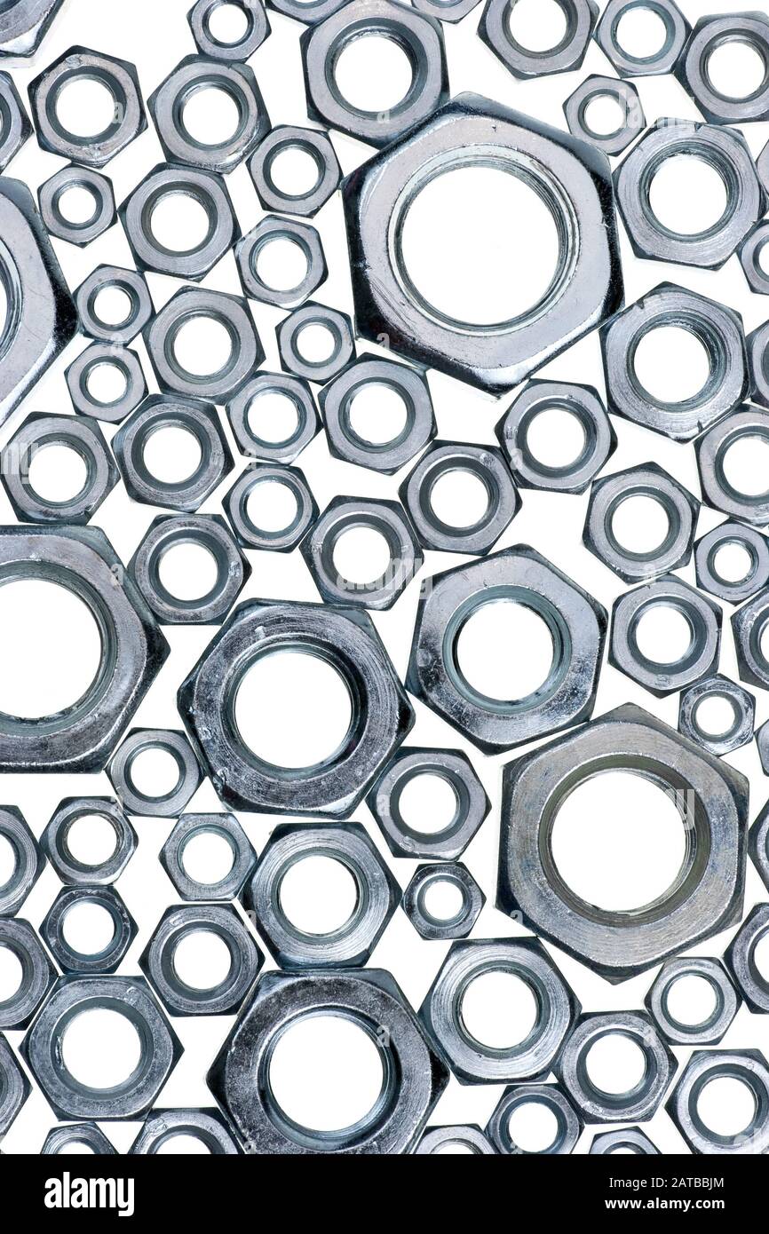 Assorted hex nuts on white background Stock Photo - Alamy