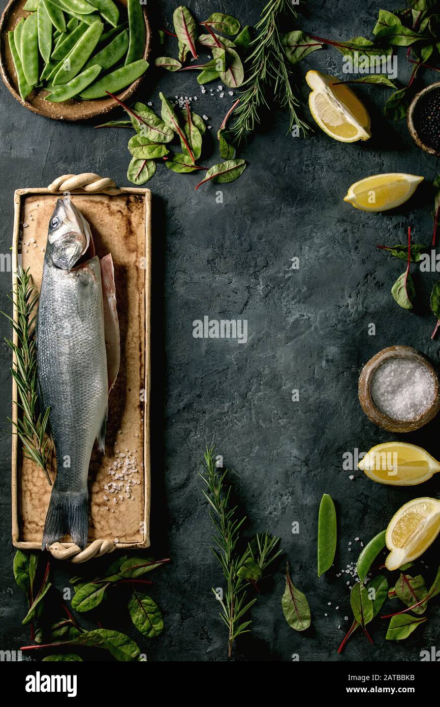 Raw uncooked fish sea bass Stock Photo - Alamy
