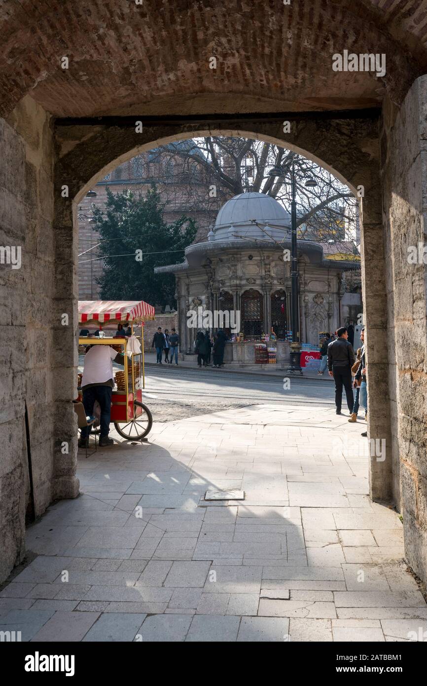 view through arched doorway of wall around Topkapi Palace and Gulhane ...