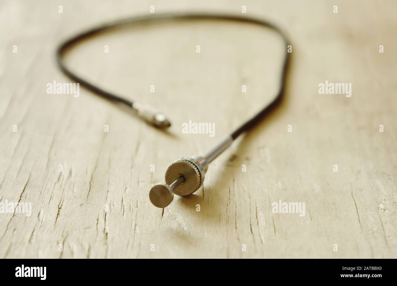 classic camera shutter cable released on wooden board Stock Photo - Alamy