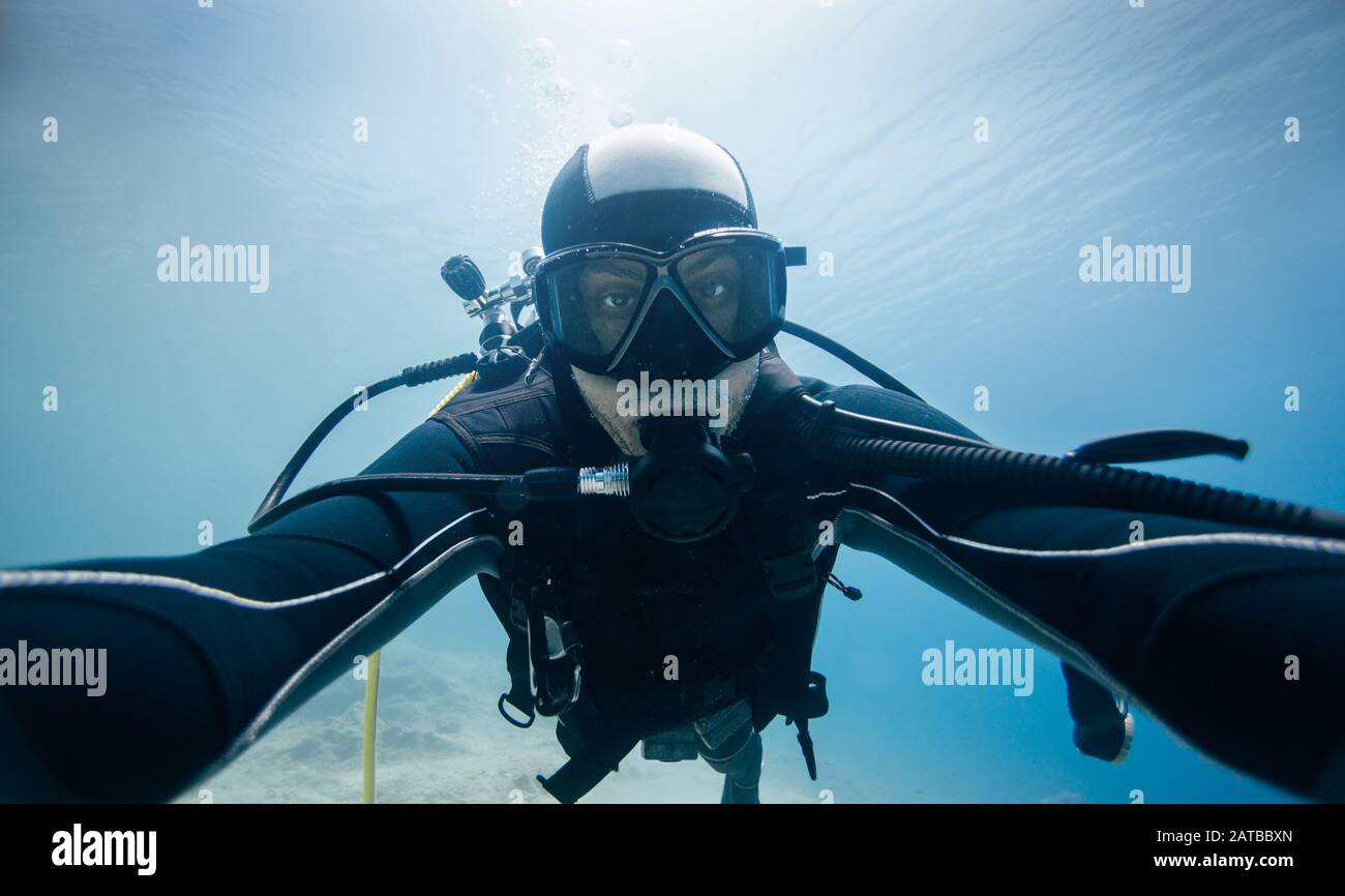 Portrait with deep blue ocean background hi-res stock photography and ...