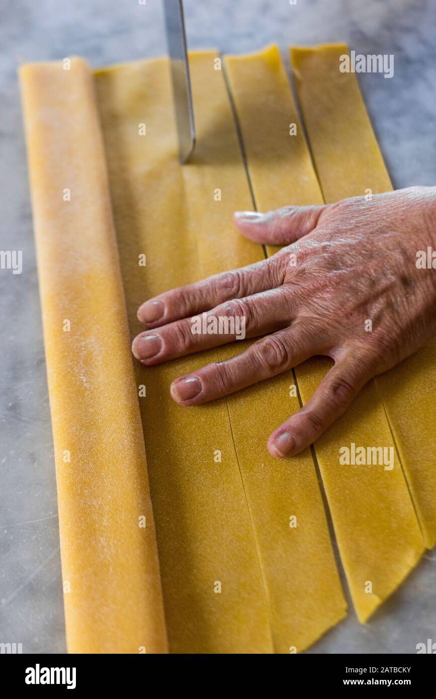 Cutting pasta dough hi-res stock photography and images - Alamy