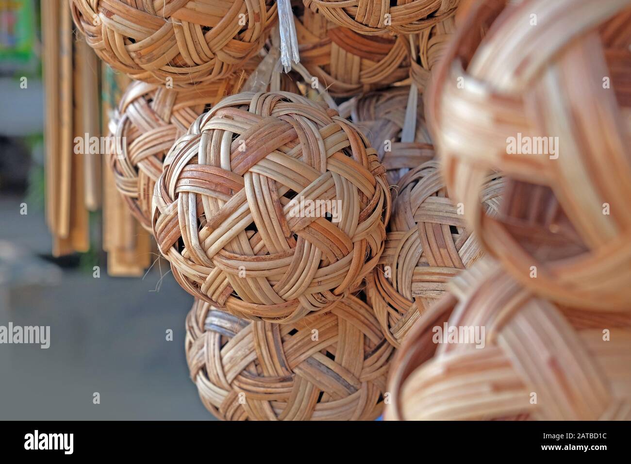 Traditional bamboo balls from Mandalay, Myanmar, in warm light brown ...