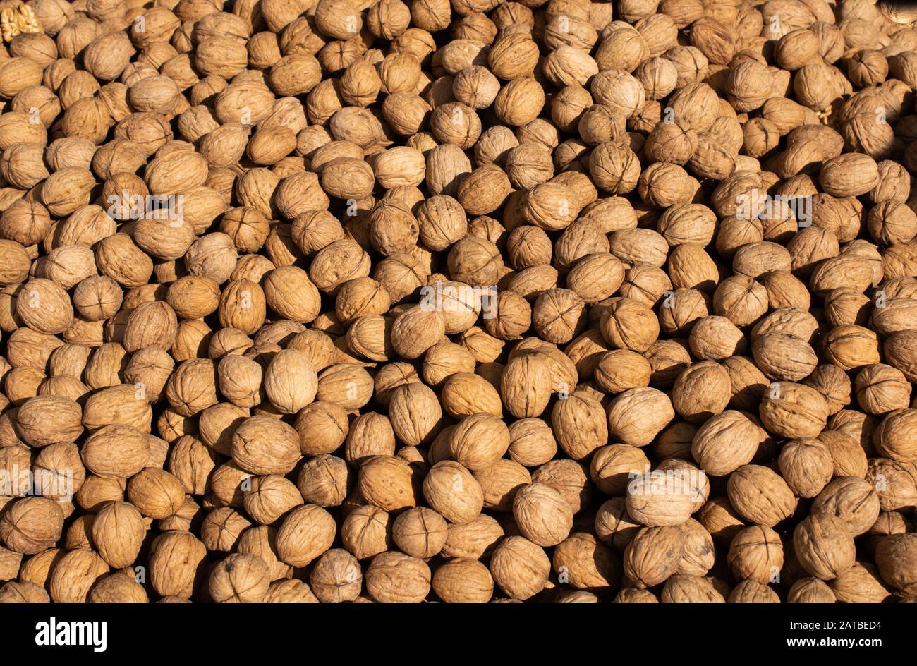Whole walnuts background. Healthy organic food concept Stock Photo - Alamy