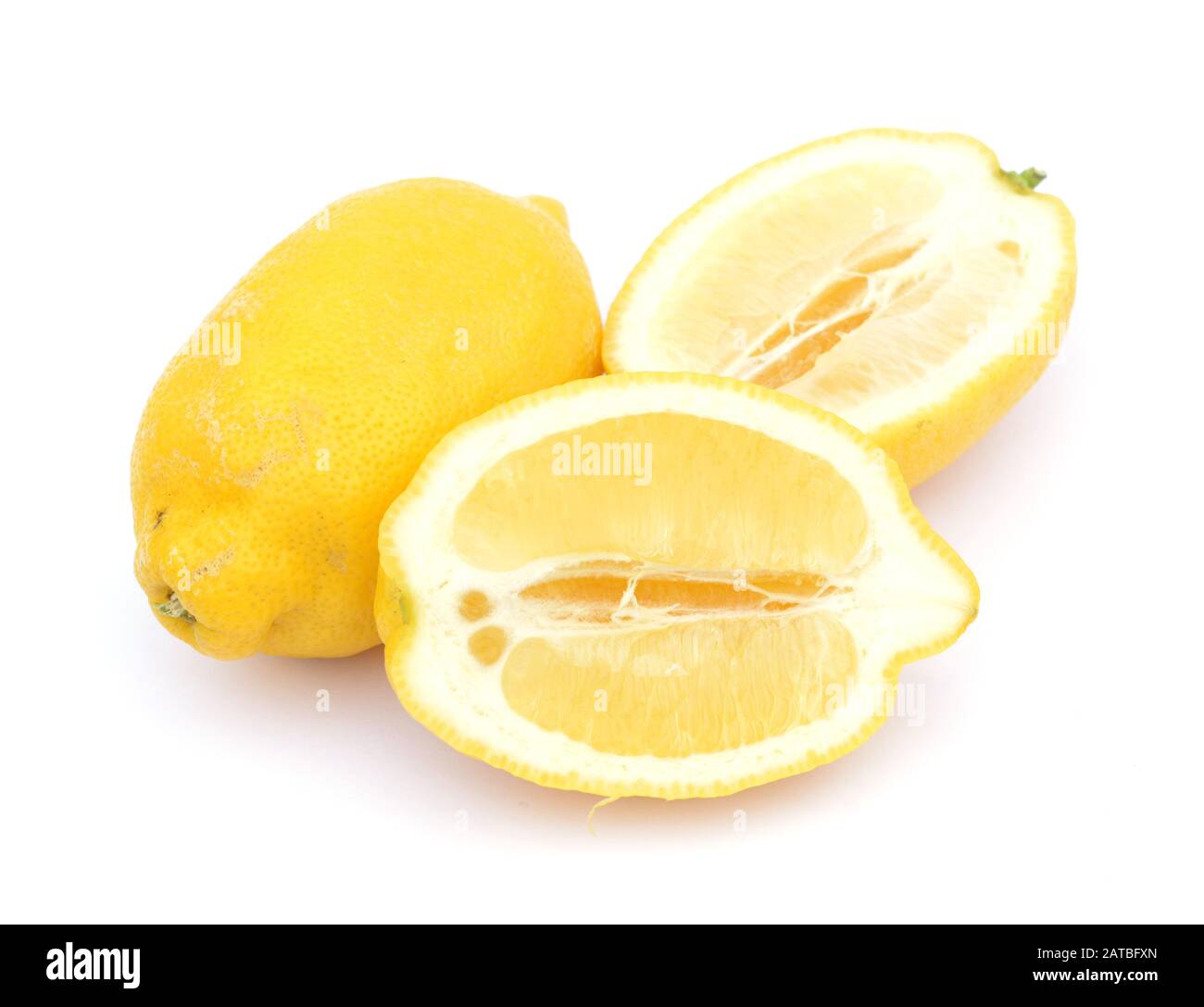Whole and chopped lemon on white Stock Photo - Alamy