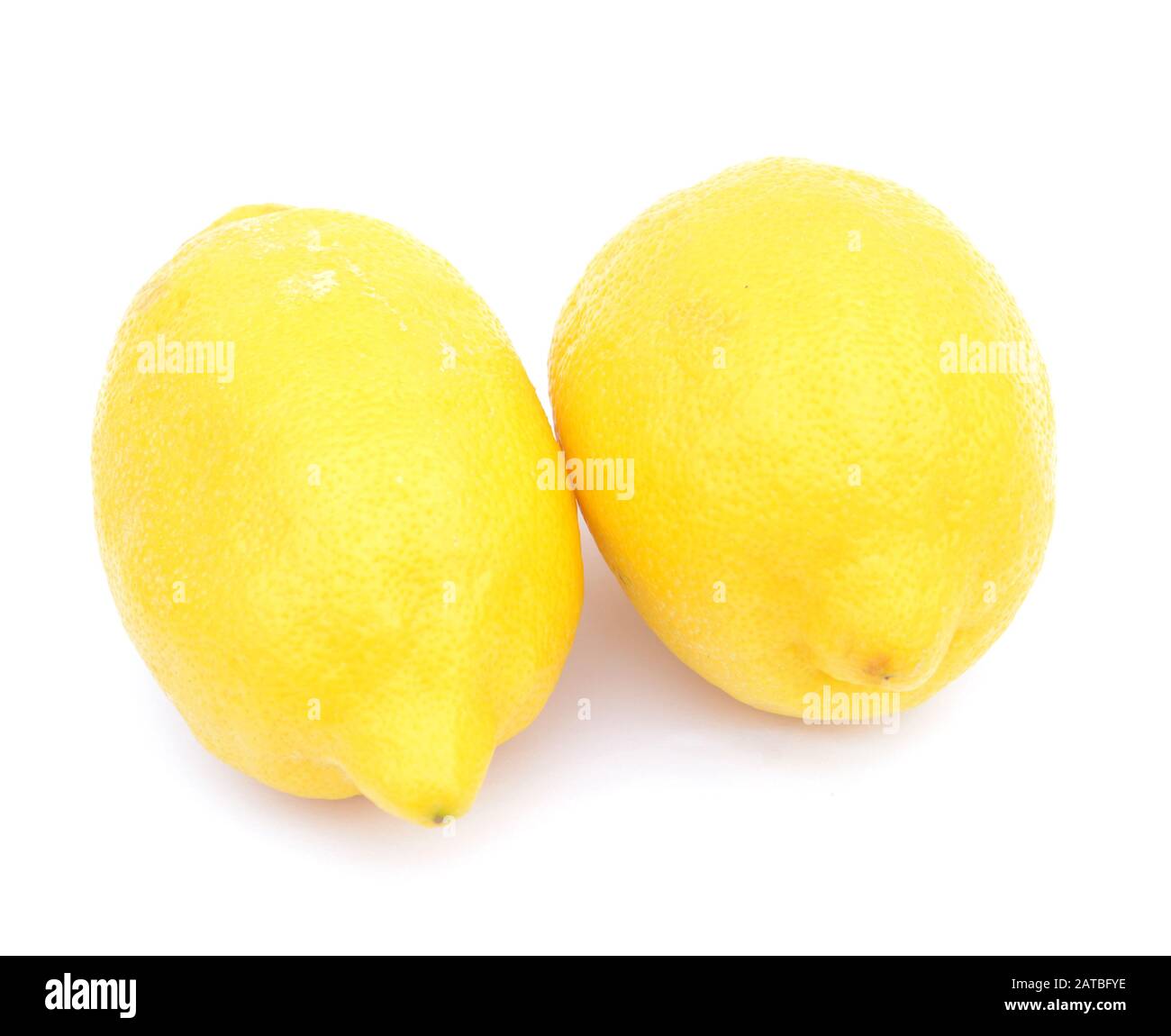Two lemon fruit on white background Stock Photo - Alamy