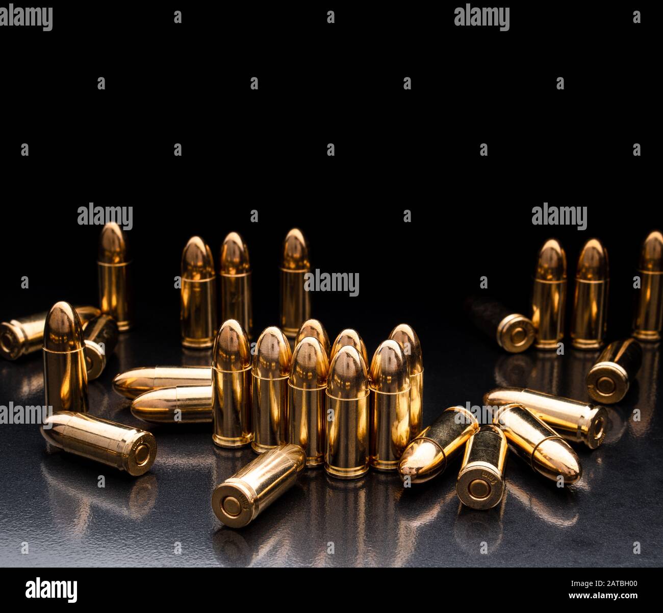 Bullet isolated on black background with reflexion. Rifle bullets close ...