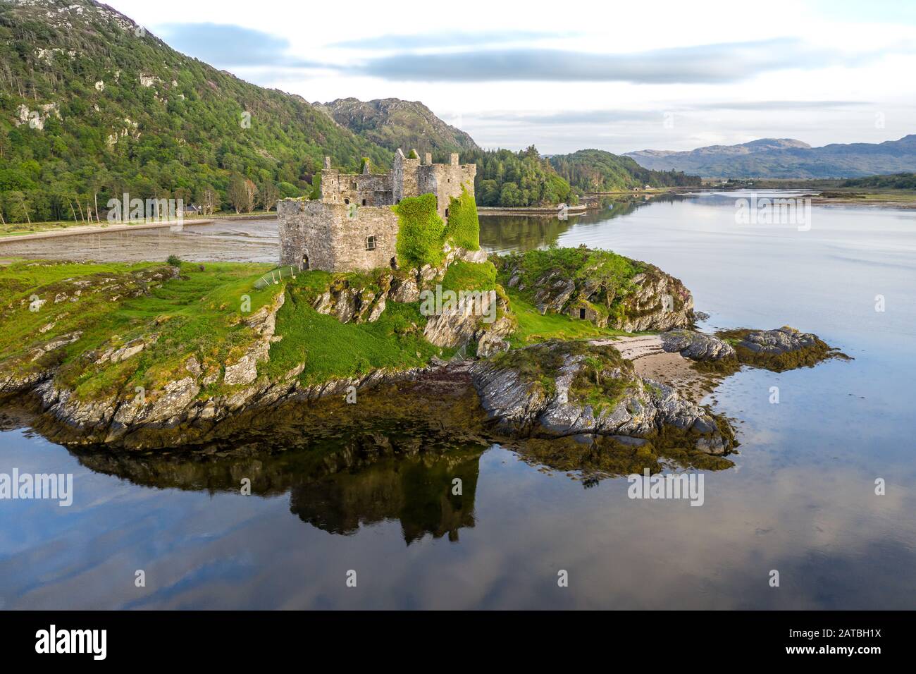 Aerial drone shot of Castle Tioram, it is a ruined castle that sits on ...