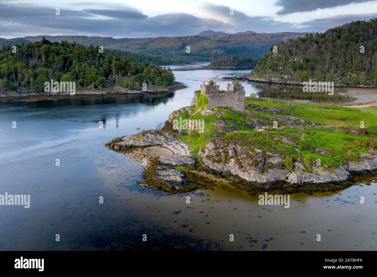 Aerial drone shot of Castle Tioram, it is a ruined castle that sits on ...